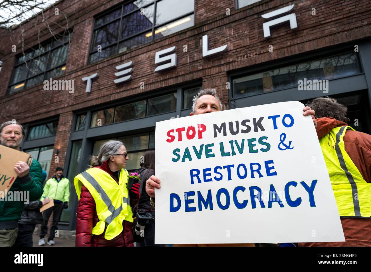 Seattle, USA. 13th Feb 2025. Activists gather at the Stop Musk To Save ...