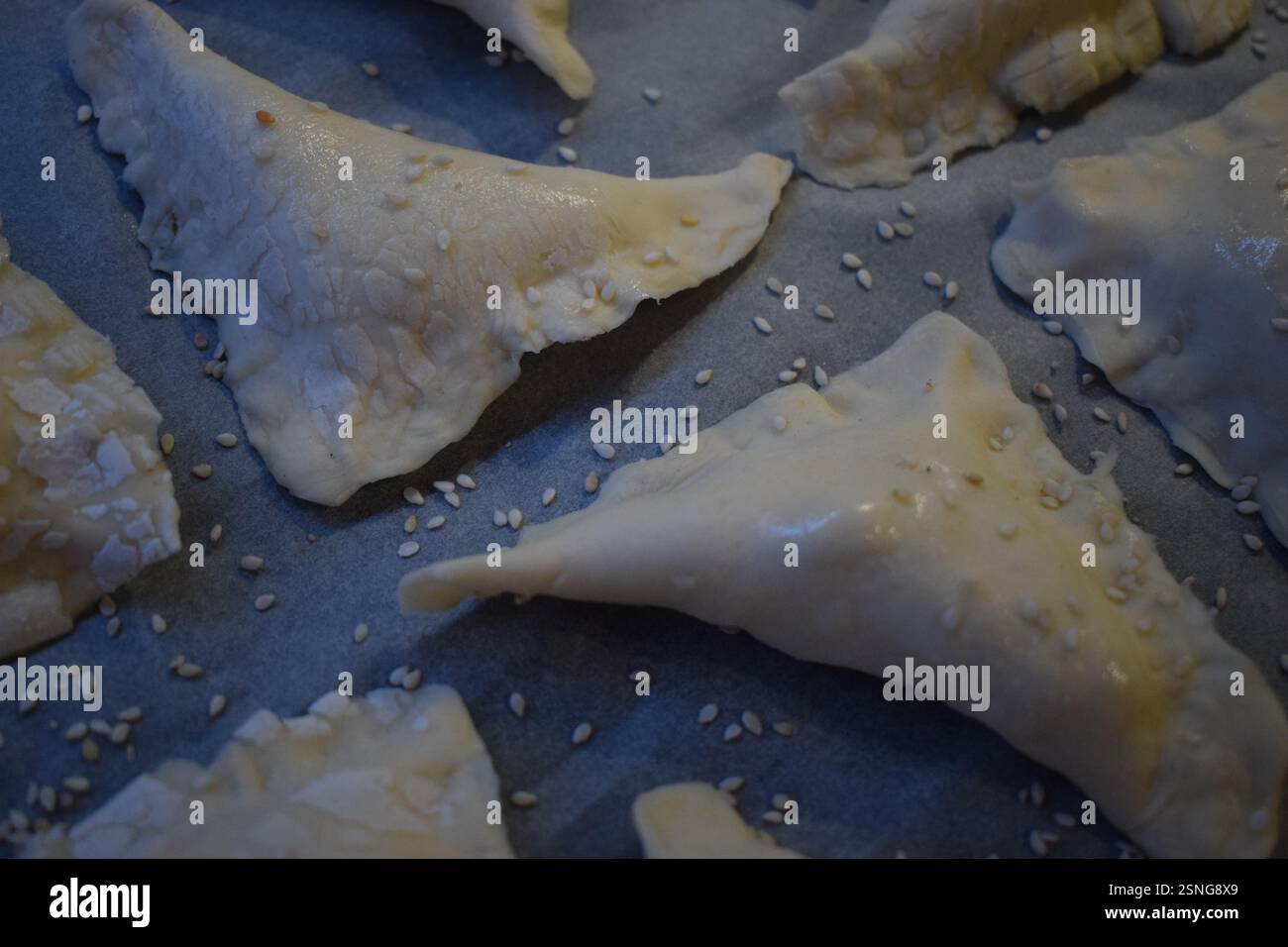 a flat baking tray lined with parchment paper, displaying neatly ...
