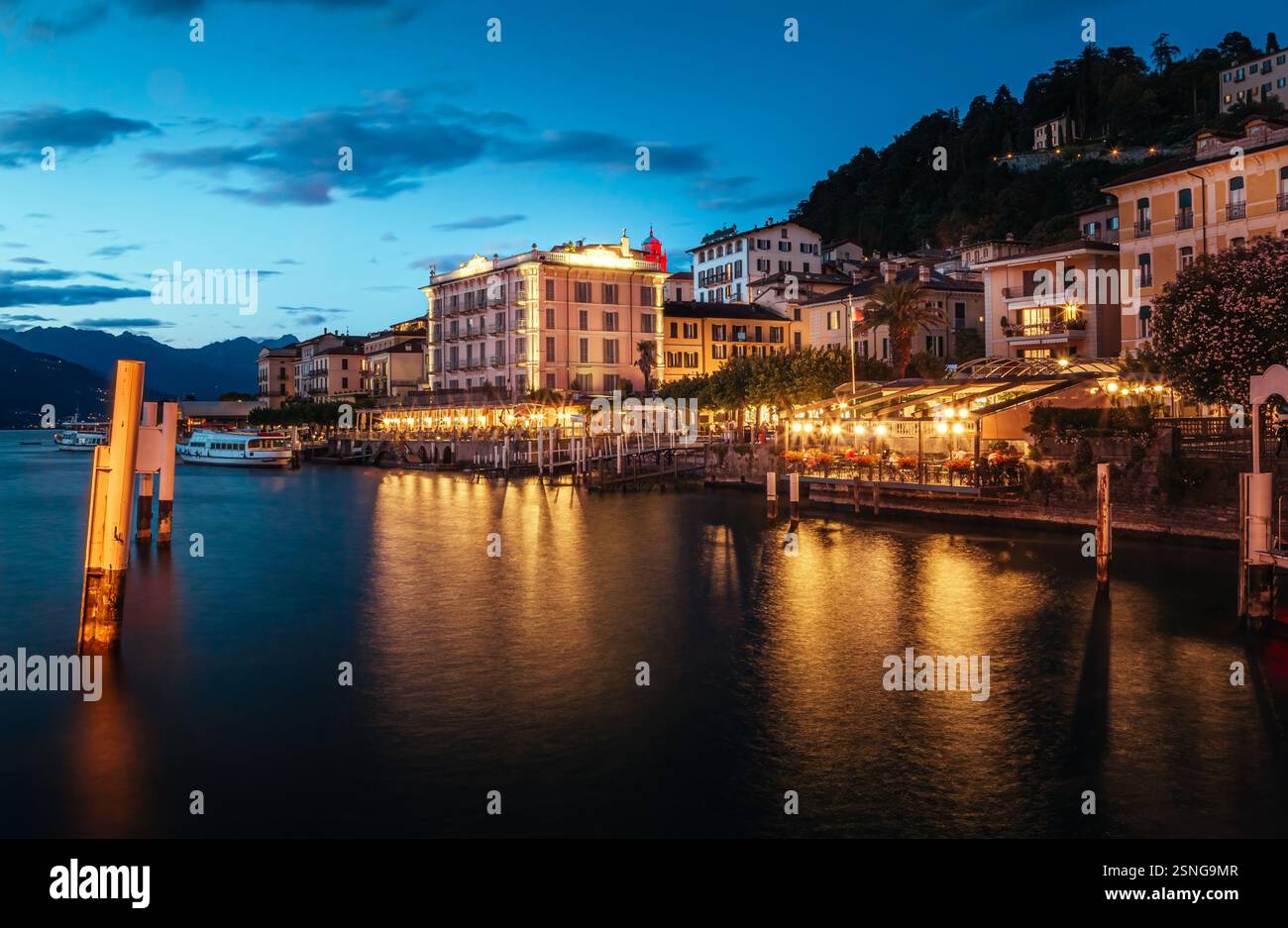 Bellagio's waterfront in Lombardy, Italy, glows with warm evening ...