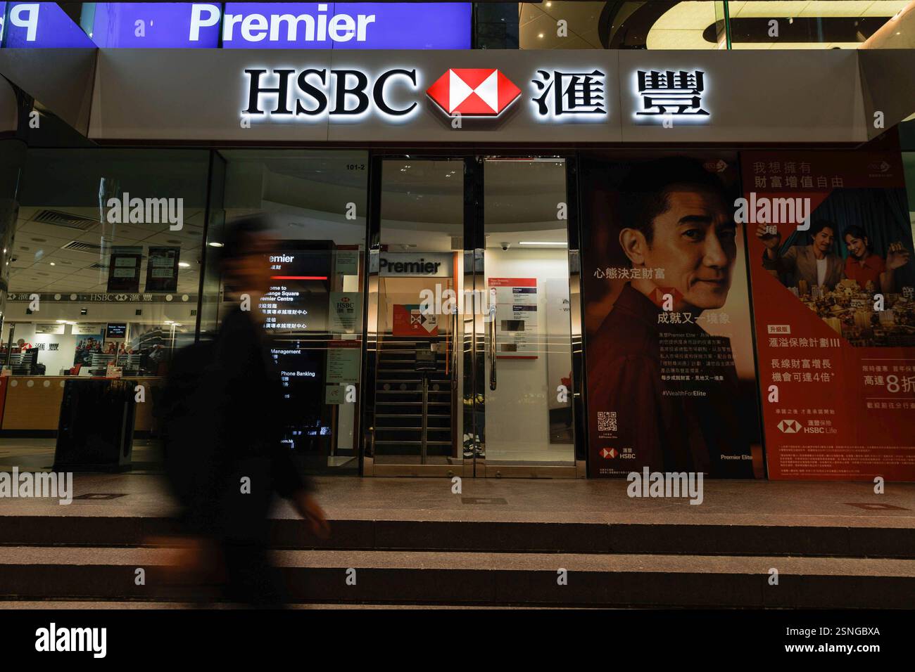 A man walks past the Hong Kong and Shanghai Bank (HSBC) in Central ...