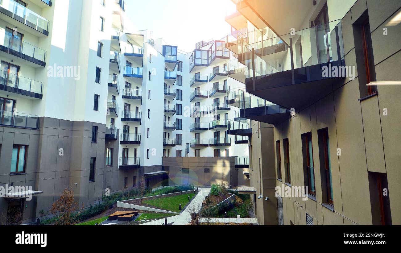Pedestrian path to entrance of multi-storey residential building. Eco ...