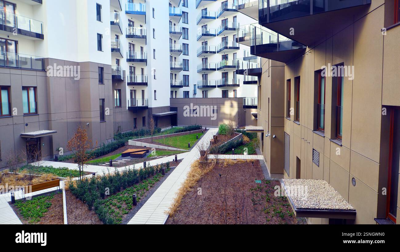 Pedestrian path to entrance of multi-storey residential building. Eco ...
