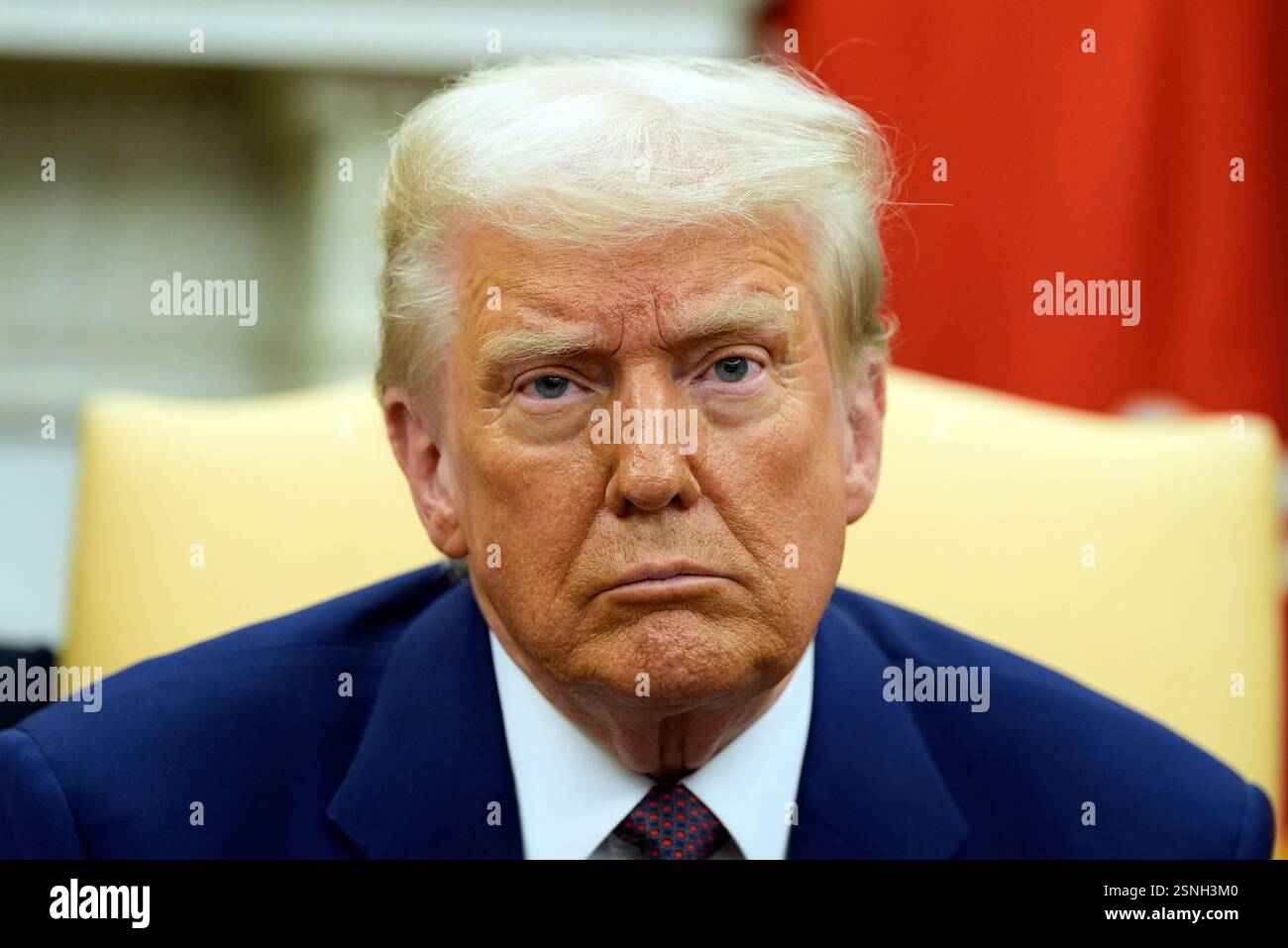 President Donald Trump listens as he meets with India's Prime Minister ...