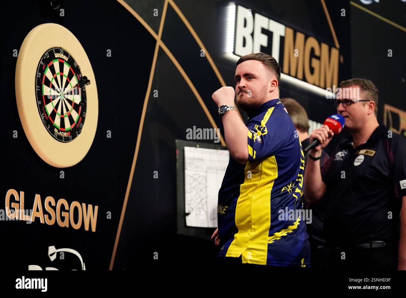 Luke Littler celebrates during his match against Michael van Gerwen on ...
