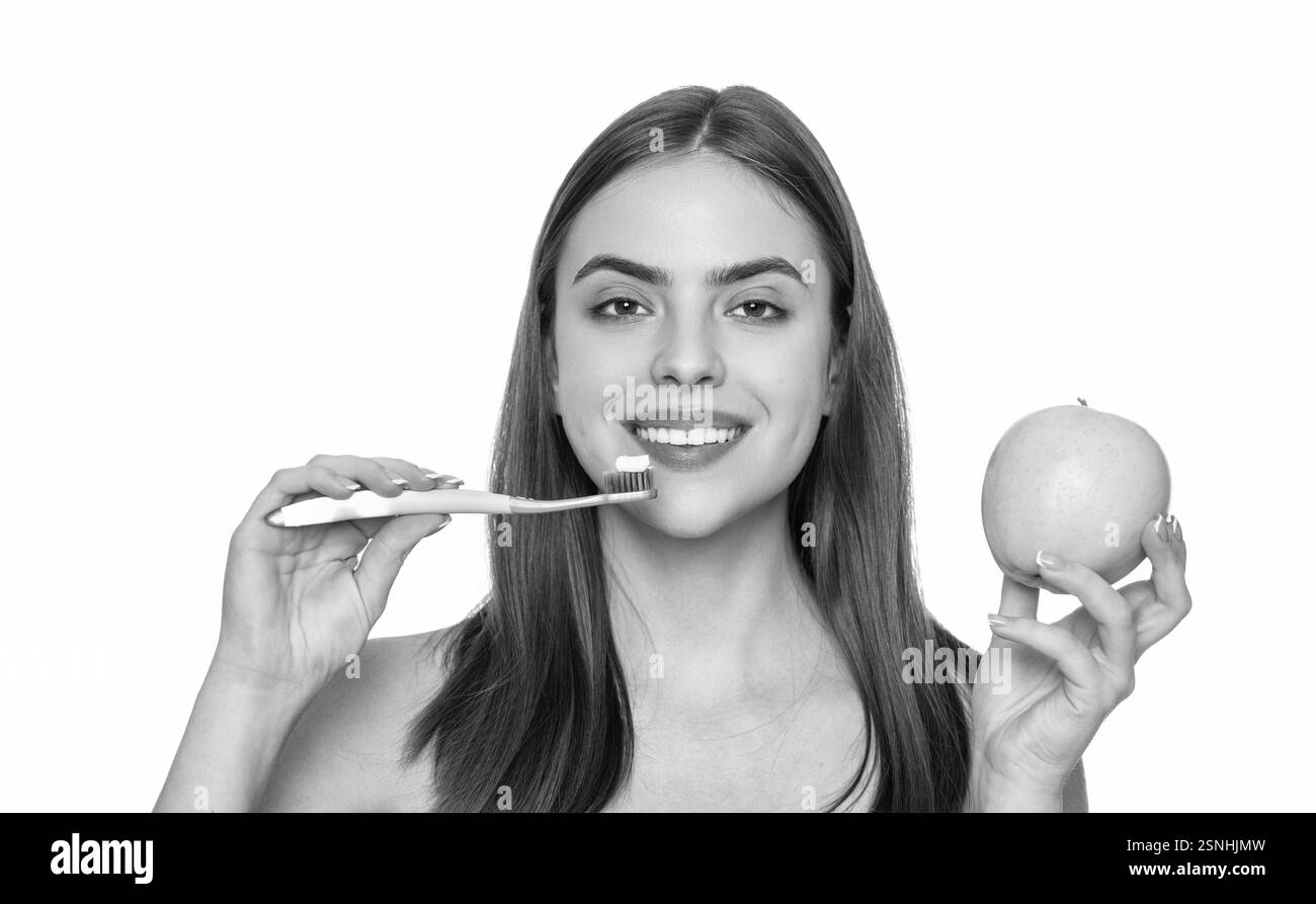 Morning routine. Woman brushing teeth with electric toothbrush. Girl ...