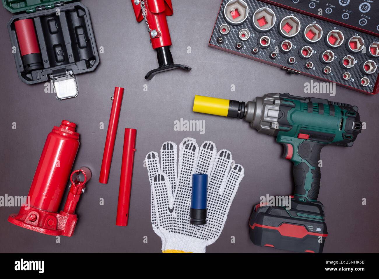 Various auto mechanic tools with cordless impact wrench for mounting ...