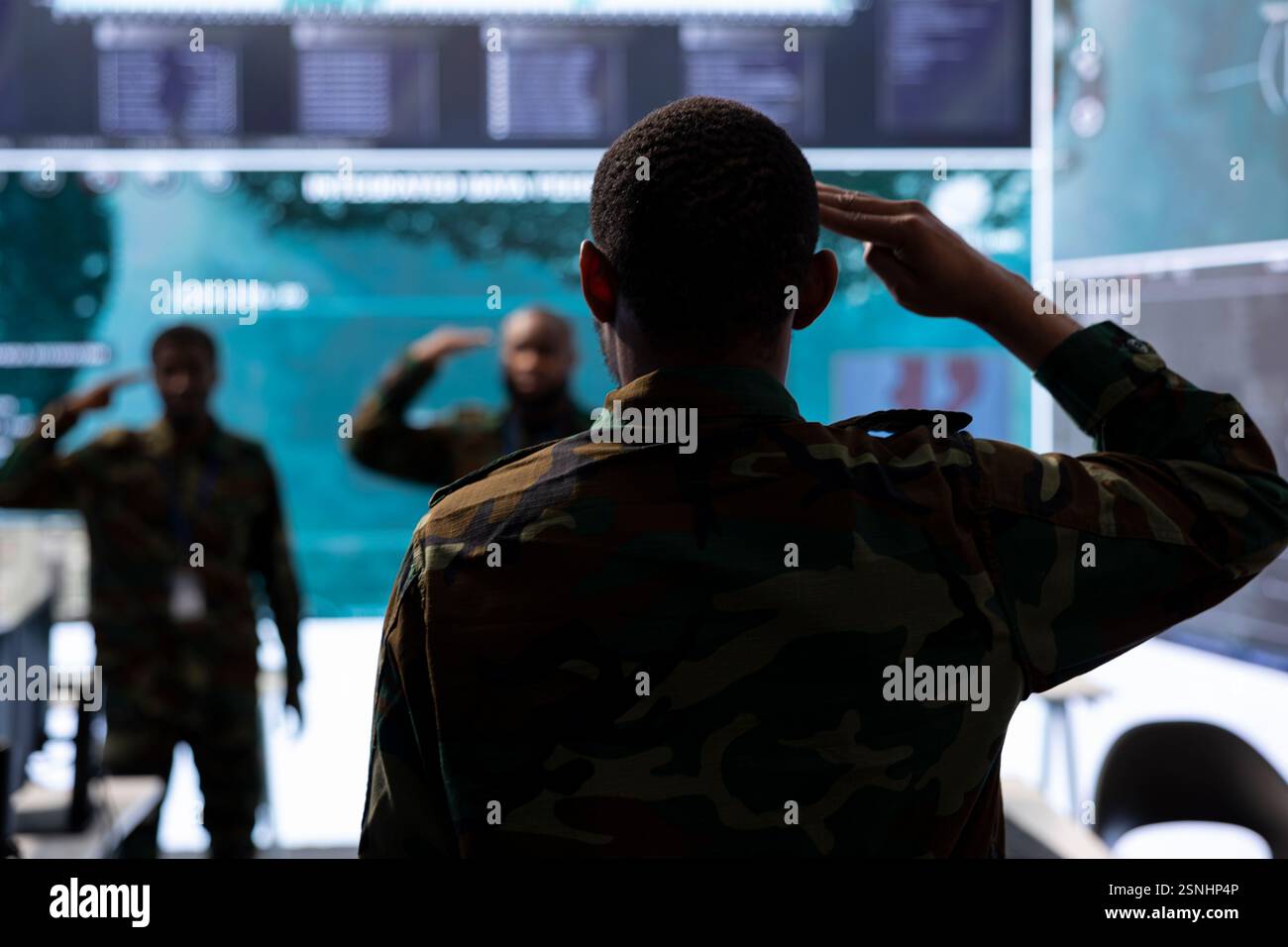 Special operations officer showing a salute in monitoring room ...