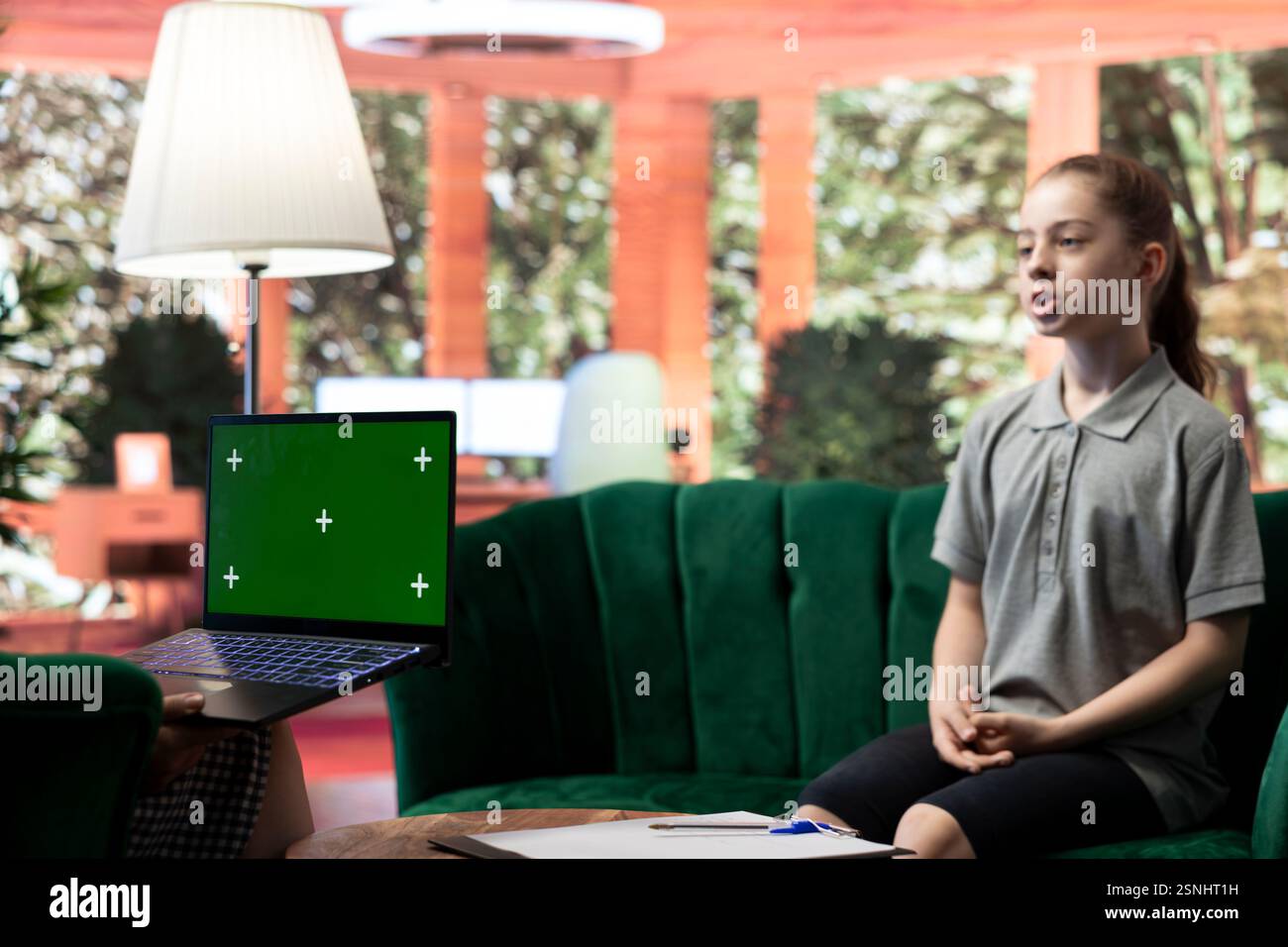 Therapist uses green screen display in a counseling session with an ...