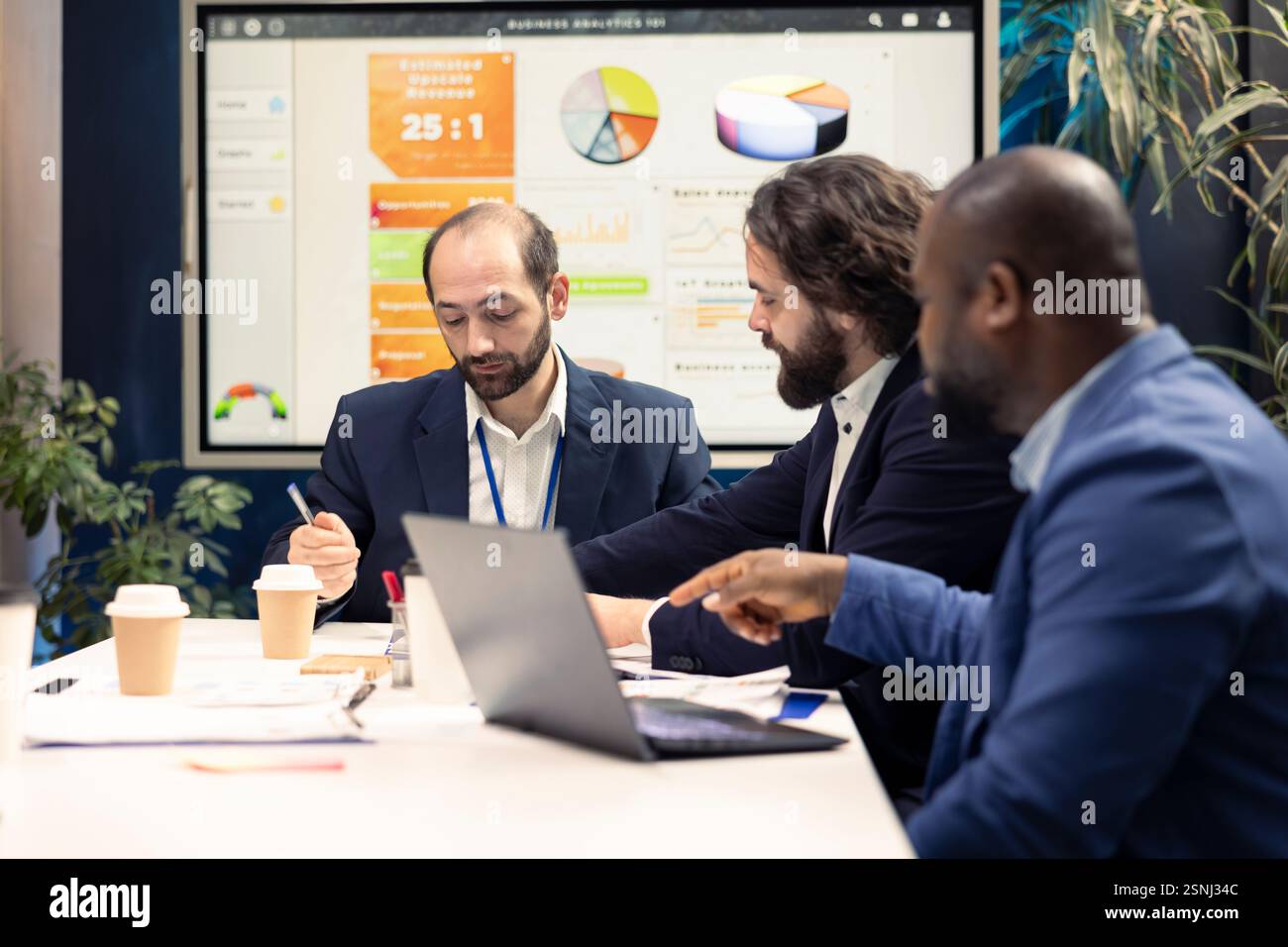 Startup employees exchanging project details and essential information ...