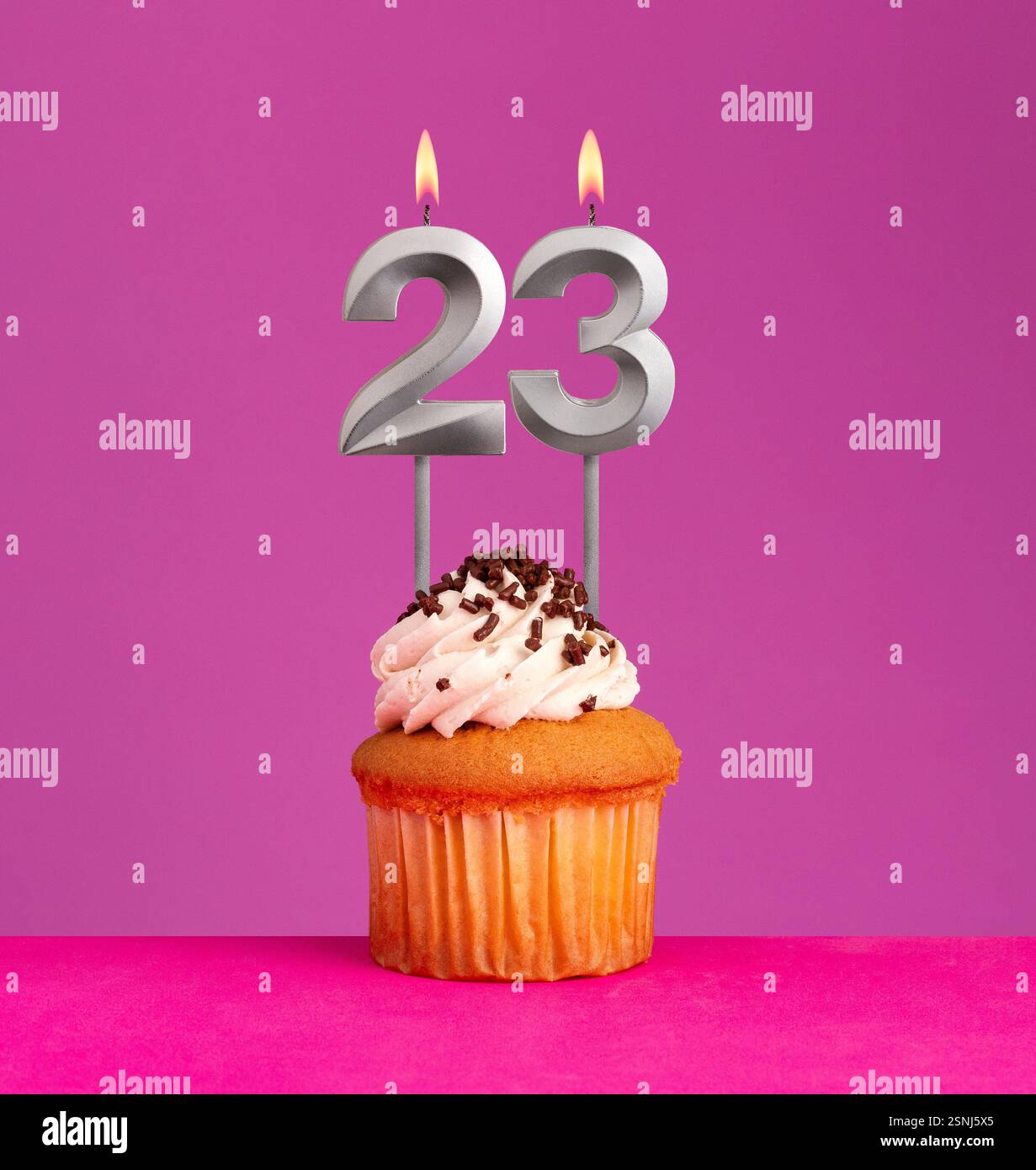 Birthday candle number 23 with cupcake on violet background Stock Photo ...