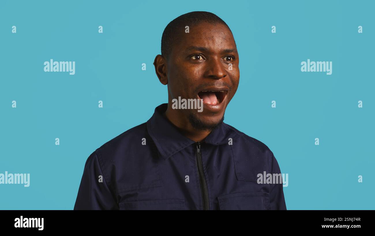 Headshot portrait of security guard feeling amazed while at work ...