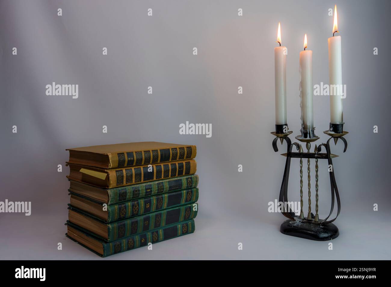 Set burning candles in dim hi-res stock photography and images - Alamy