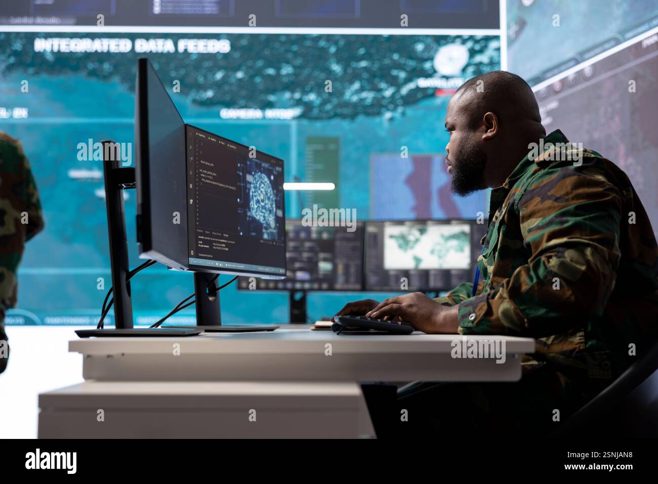 IT professional gathering real time intelligence from radar systems in military control tower ...