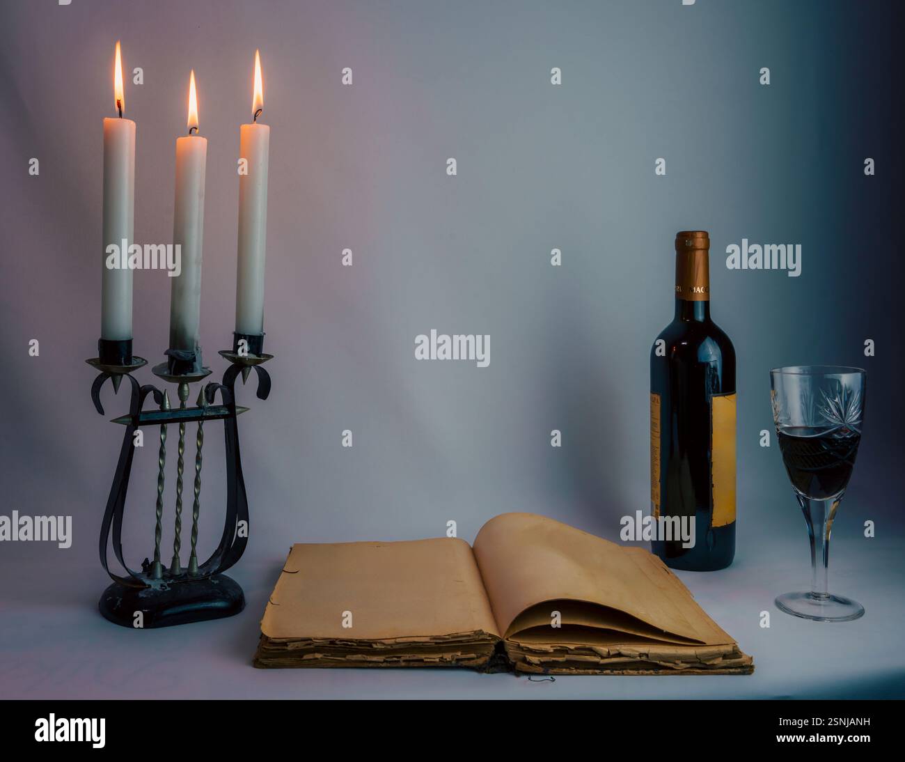 Set burning candles in dim hi-res stock photography and images - Alamy