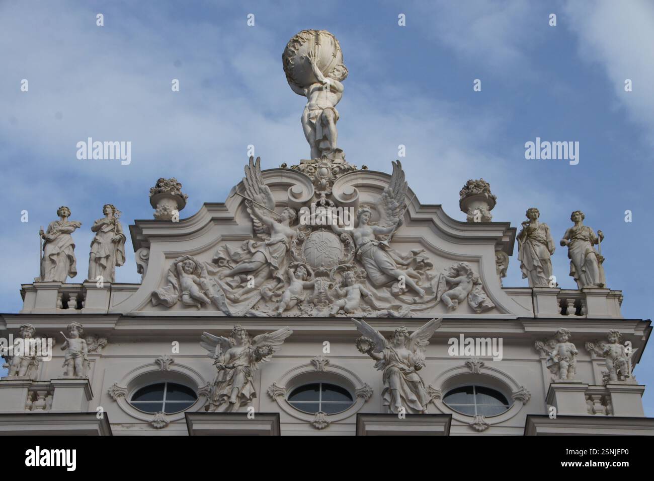 Atop Linderhof Palace in Germany, Munich, stands a gilded statue of ...