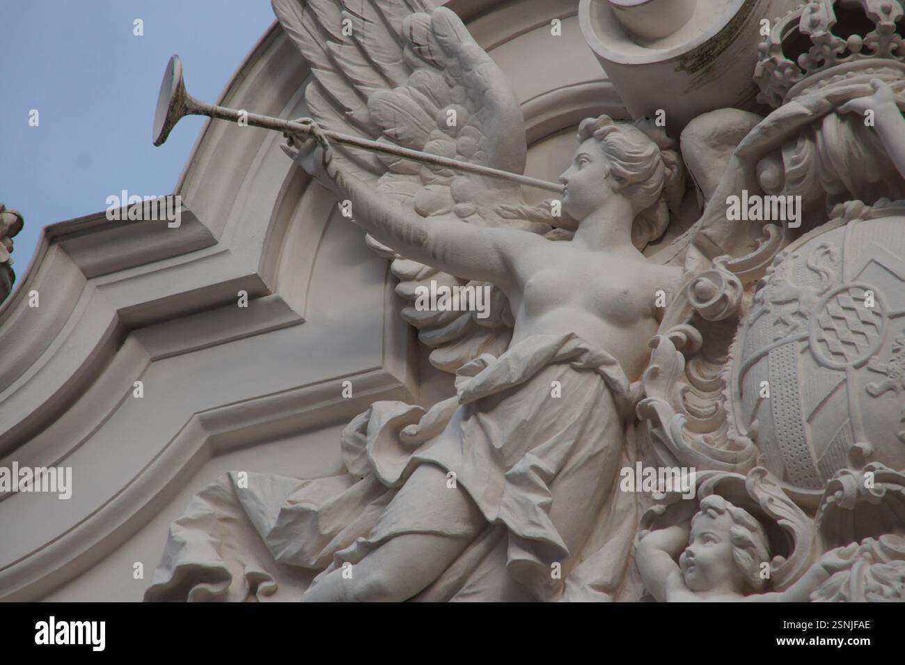 In Germany, Munich, a statue of a winged angel holding a trumpet stands ...