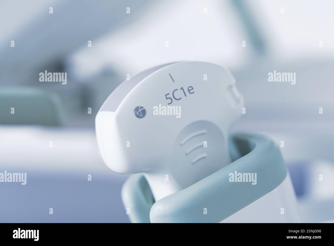 Close-up of a white ultrasound probe in a clinical setting, Urology ...