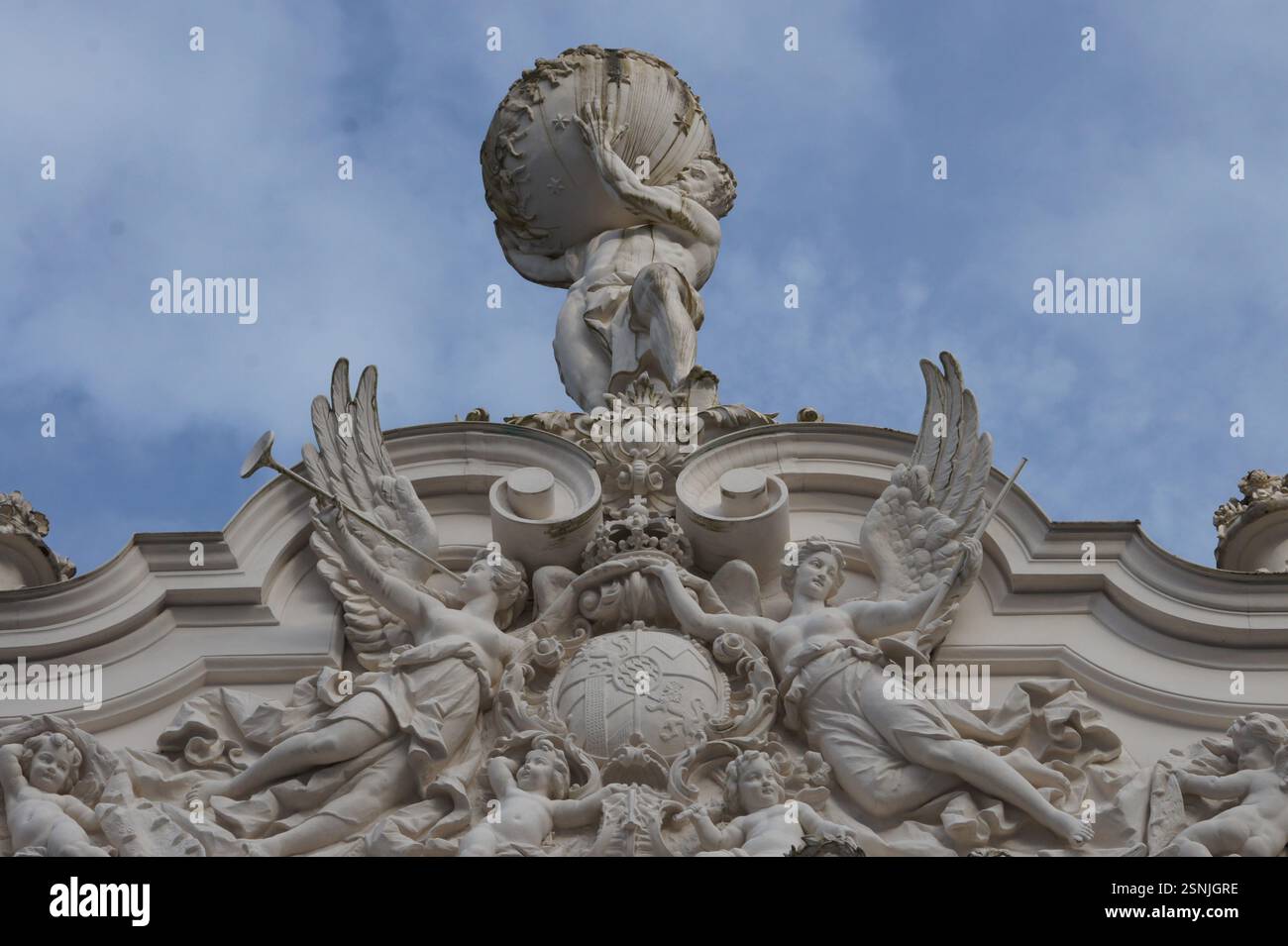 The gilded statue of Atlas holding a globe atop a building in Ettal ...