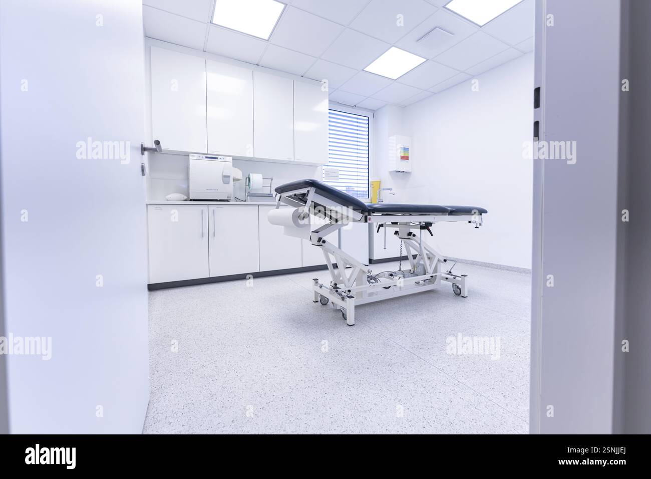 Bright treatment room in the clinic, modernly equipped with examination ...