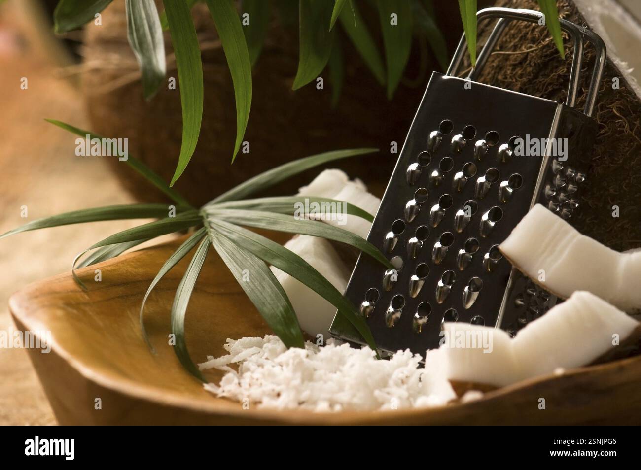 Grated coconut with grater and nut, lodz, poland Stock Photo - Alamy