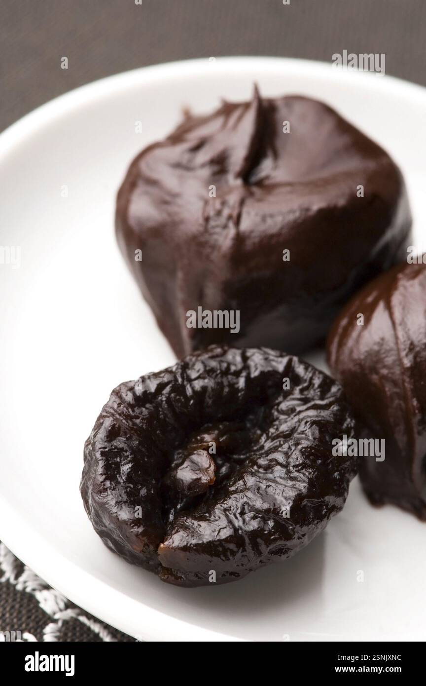 Dried plums in chocolate, lodz, poland Stock Photo - Alamy