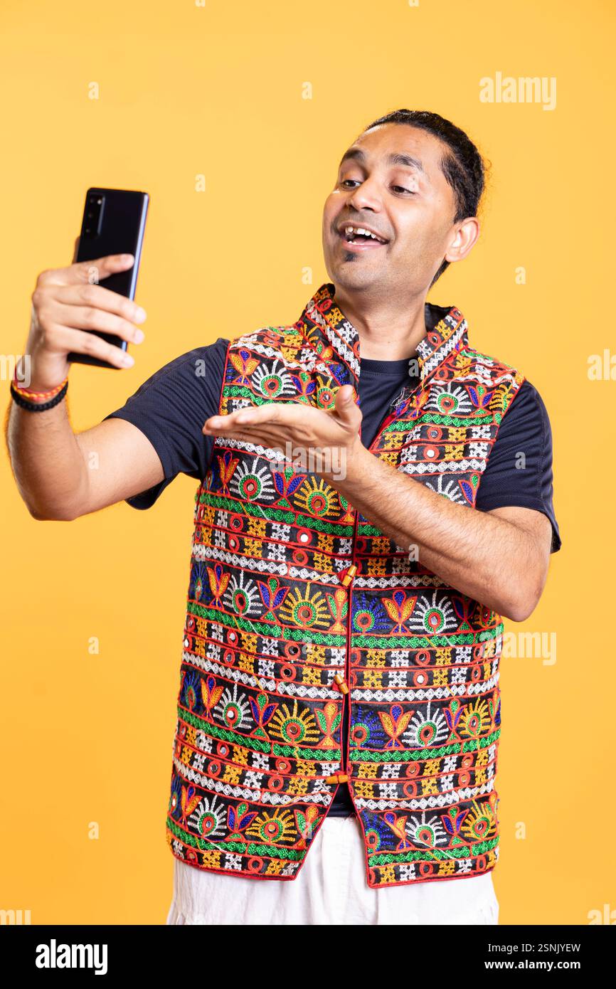 Jolly man communicating with hilarious friend over remote videocall ...