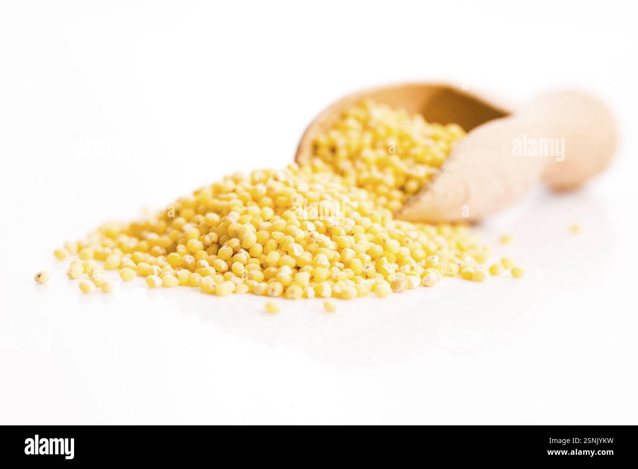 Heap of millet groats on white Stock Photo - Alamy