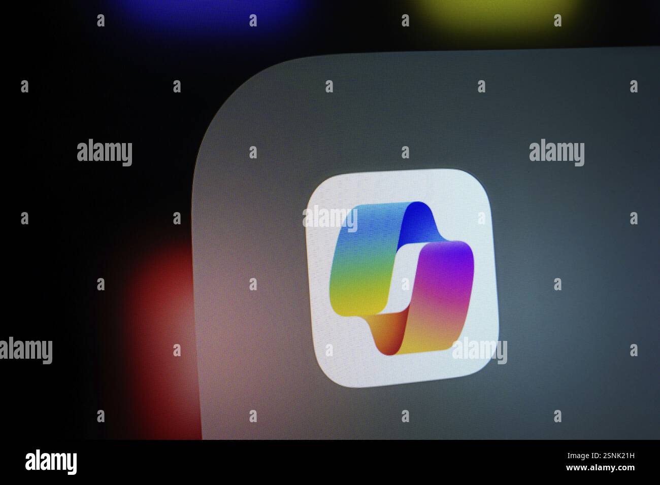 A close up of an iPad screen displaying the Microsoft copilot app icon ...