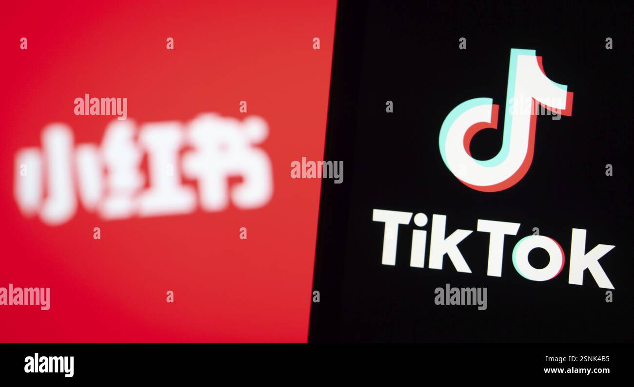 Tiktok logo is seen on a smartphone and Rednote (Xiaohongshu) in the ...