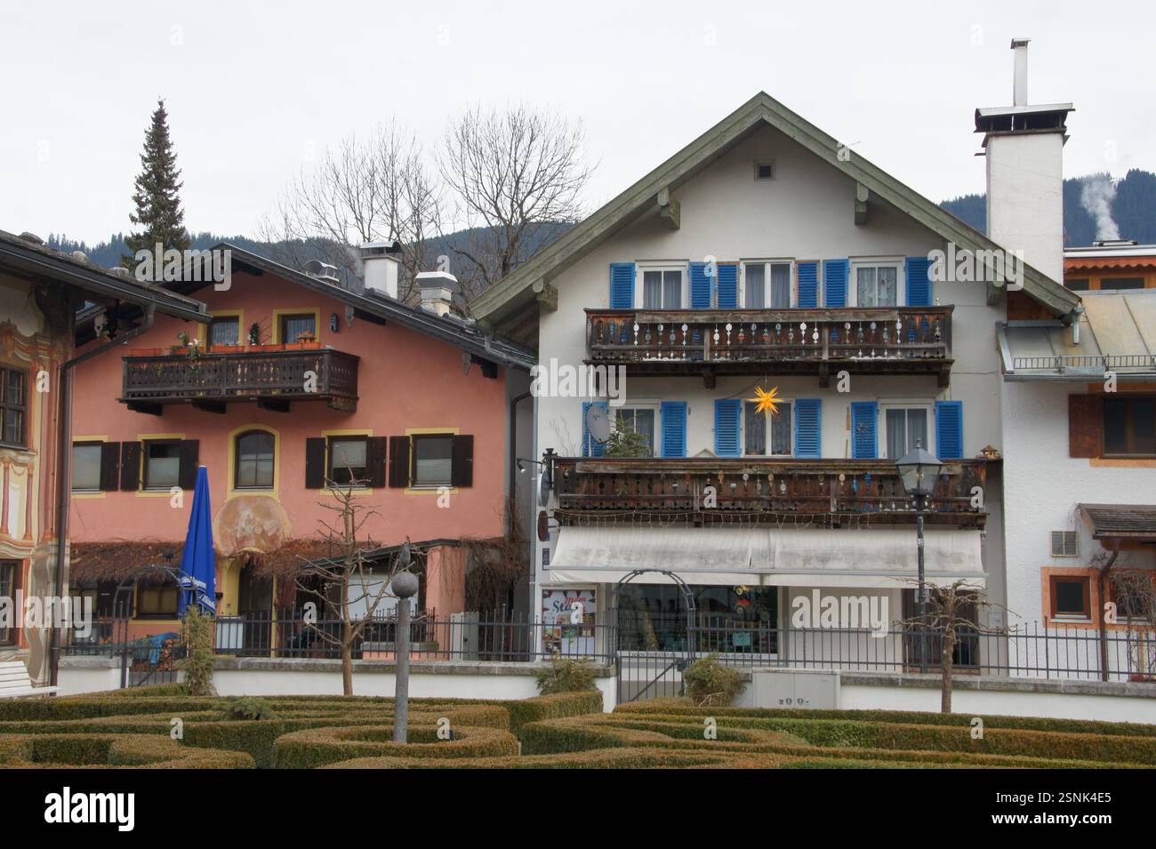 A colorful building in Germany, Munich boasts a star decoration on its ...