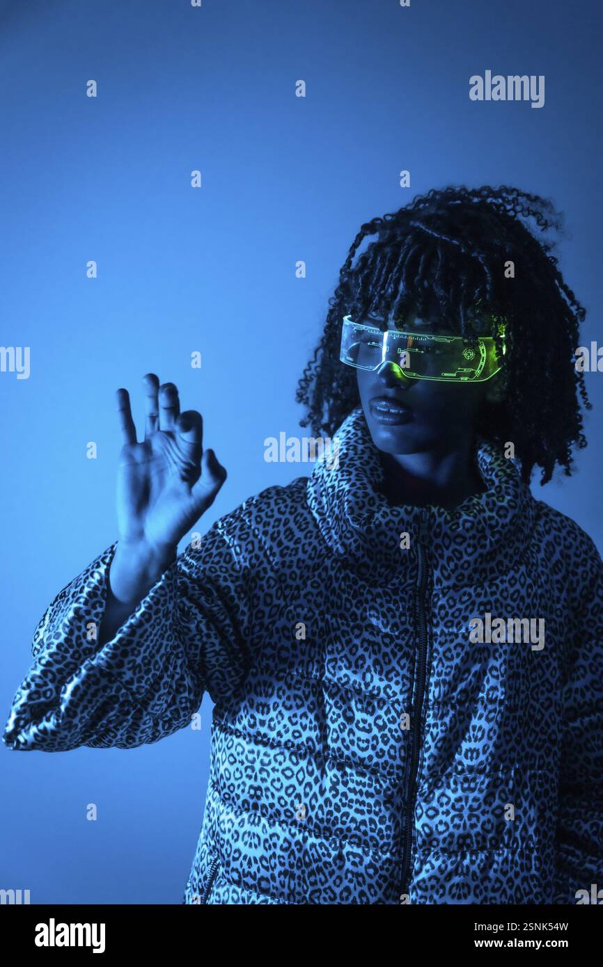 Software engineer wearing futuristic glasses using augmented reality ...
