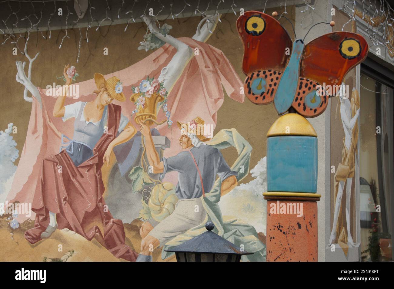 In Germany, Munich, a mural depicts a brightly dressed couple standing ...