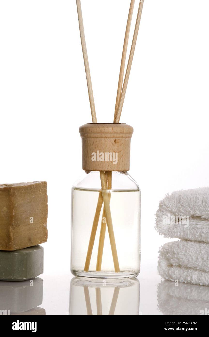 Aroma therapy objects. bottle of esential oil, towels, soap Stock Photo ...