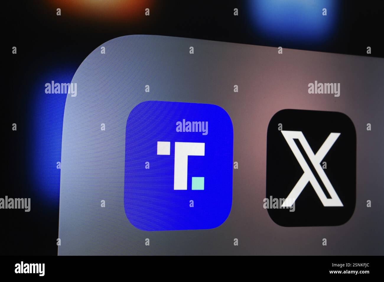 A close up of an iPad screen displaying the Truth Social and X app ...