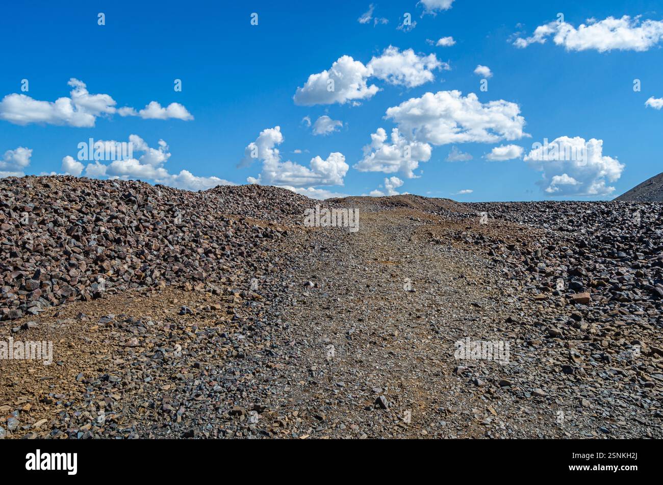 Slag mountains in the mining town of Roros, Norway. Slag is a by ...