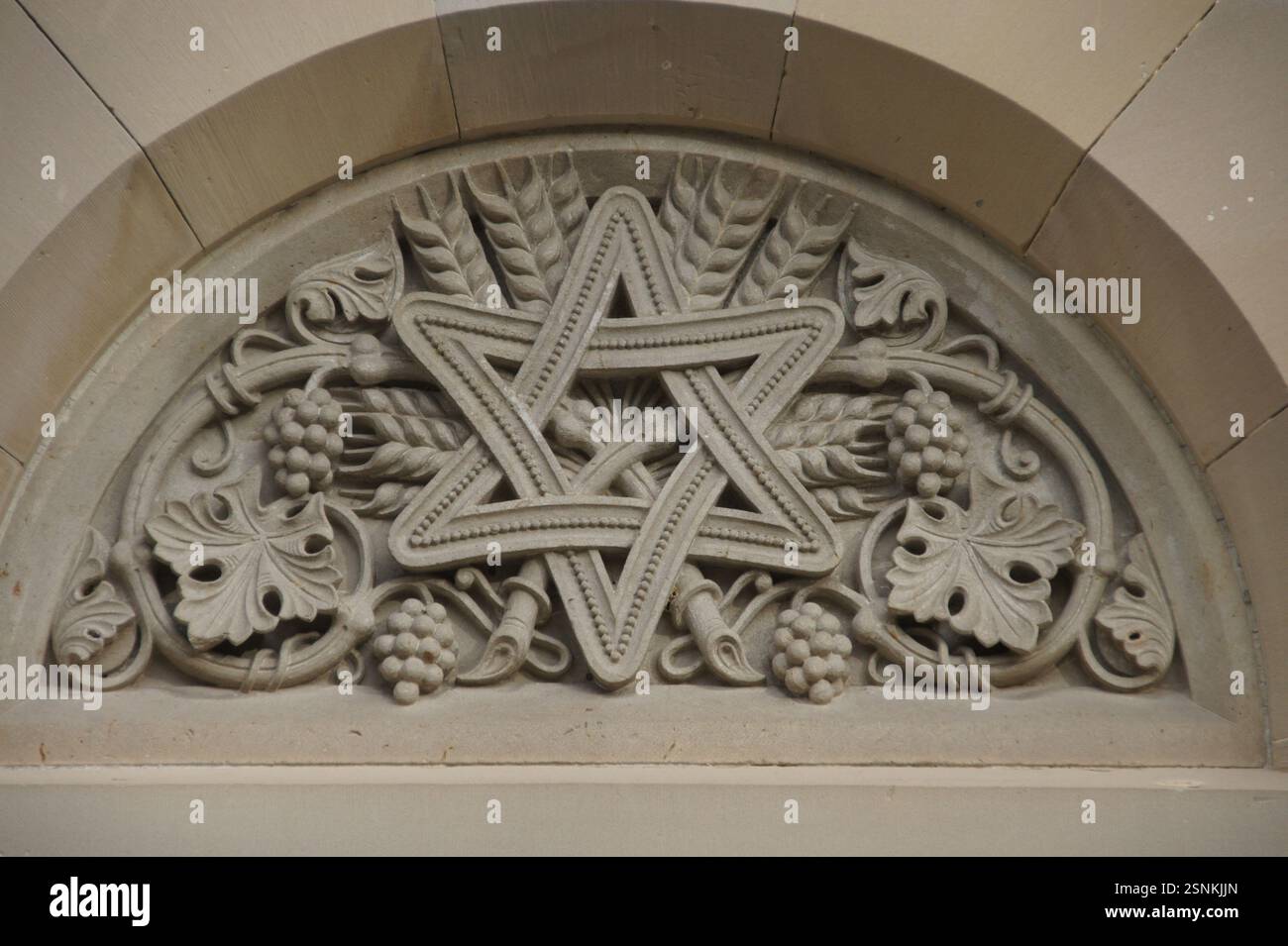 An image containing a stone carving of a six-pointed star, a common ...