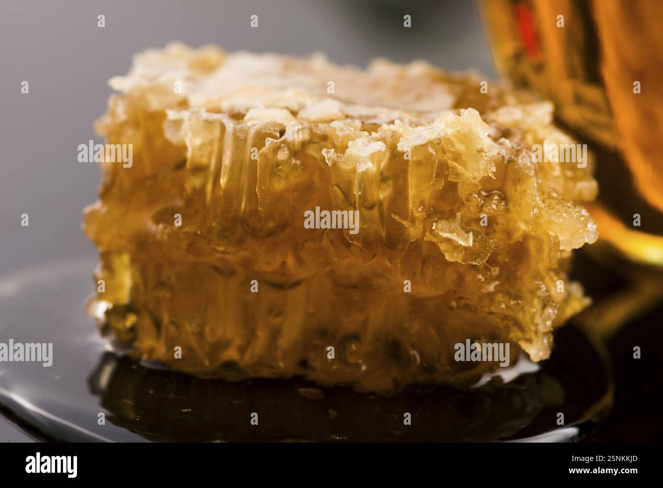 Fresh honey with honeycomb Stock Photo - Alamy