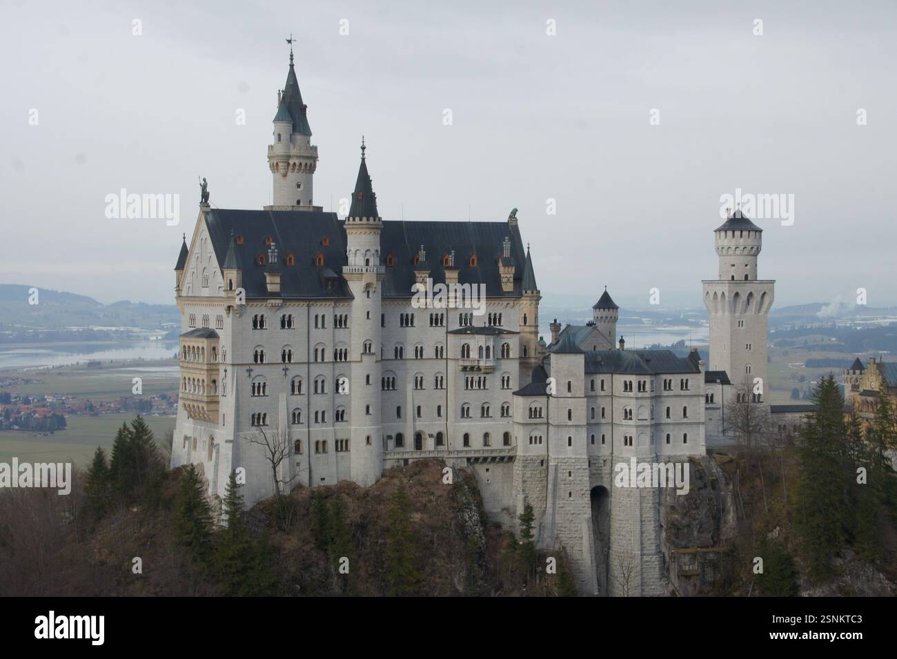 Germany, Munich. Dramatic white Neuschwanstein Castle, a Bavarian ...