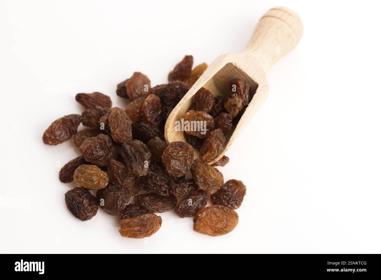 Dried sultanas on a white background Stock Photo - Alamy