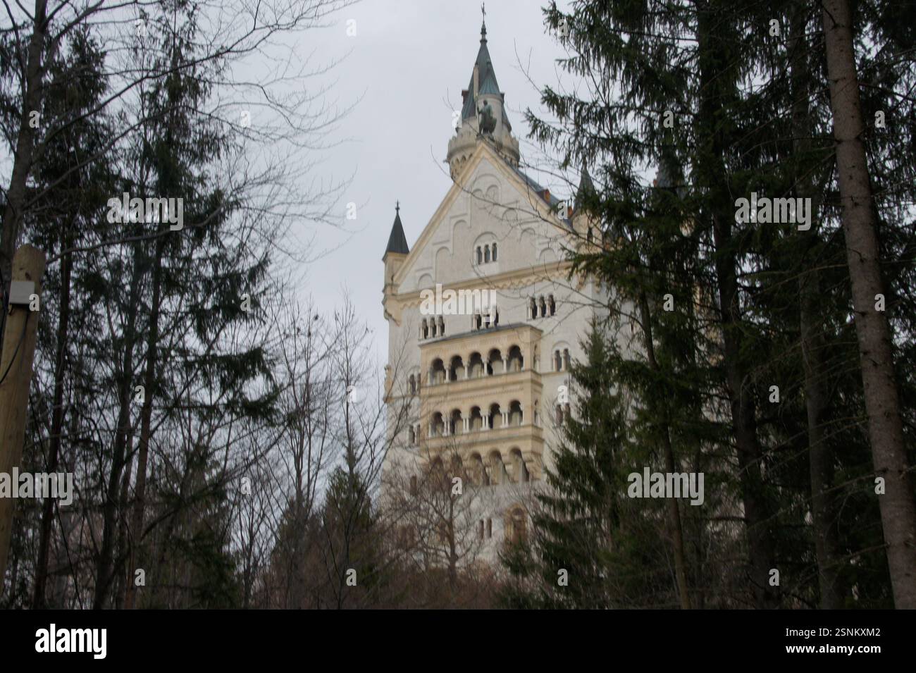 Germany, Munich. A white castle stands tall and imposing in the middle ...
