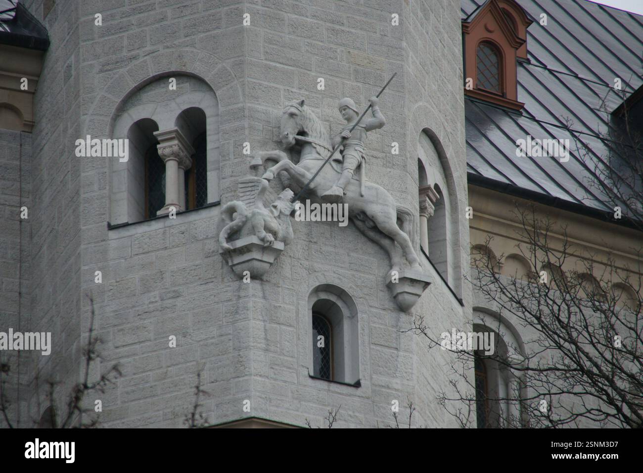 In Germany, Munich, a statue depicts a knight on horseback battling a ...