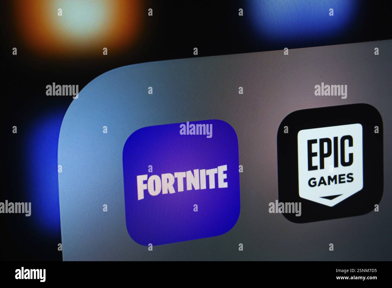 A close up of an iPad screen displaying the Epic Games and Fortnite app ...
