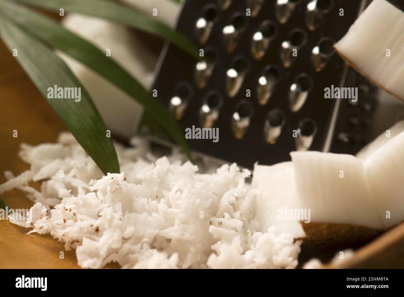 Grated coconut with grater and nut, lodz, poland Stock Photo - Alamy