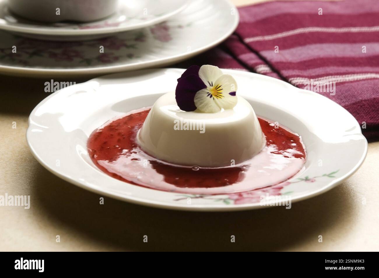 Vanilla panna cotta with berry sauce and spring flower, lodz, poland ...