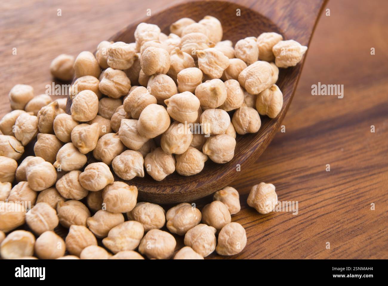 Dried white chickpeas ceci on the wooden spoon, lodz, poland Stock ...