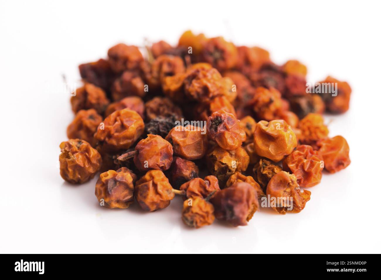 Dried rowan berries on a white background Stock Photo - Alamy