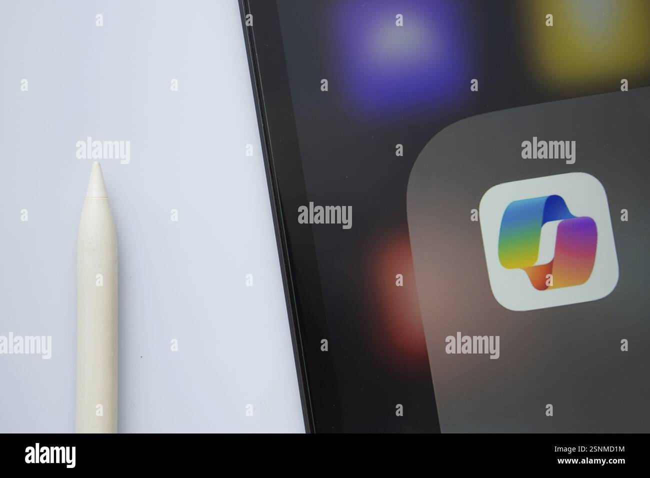 A close up of an iPad screen displaying the Microsoft copilot app icon ...