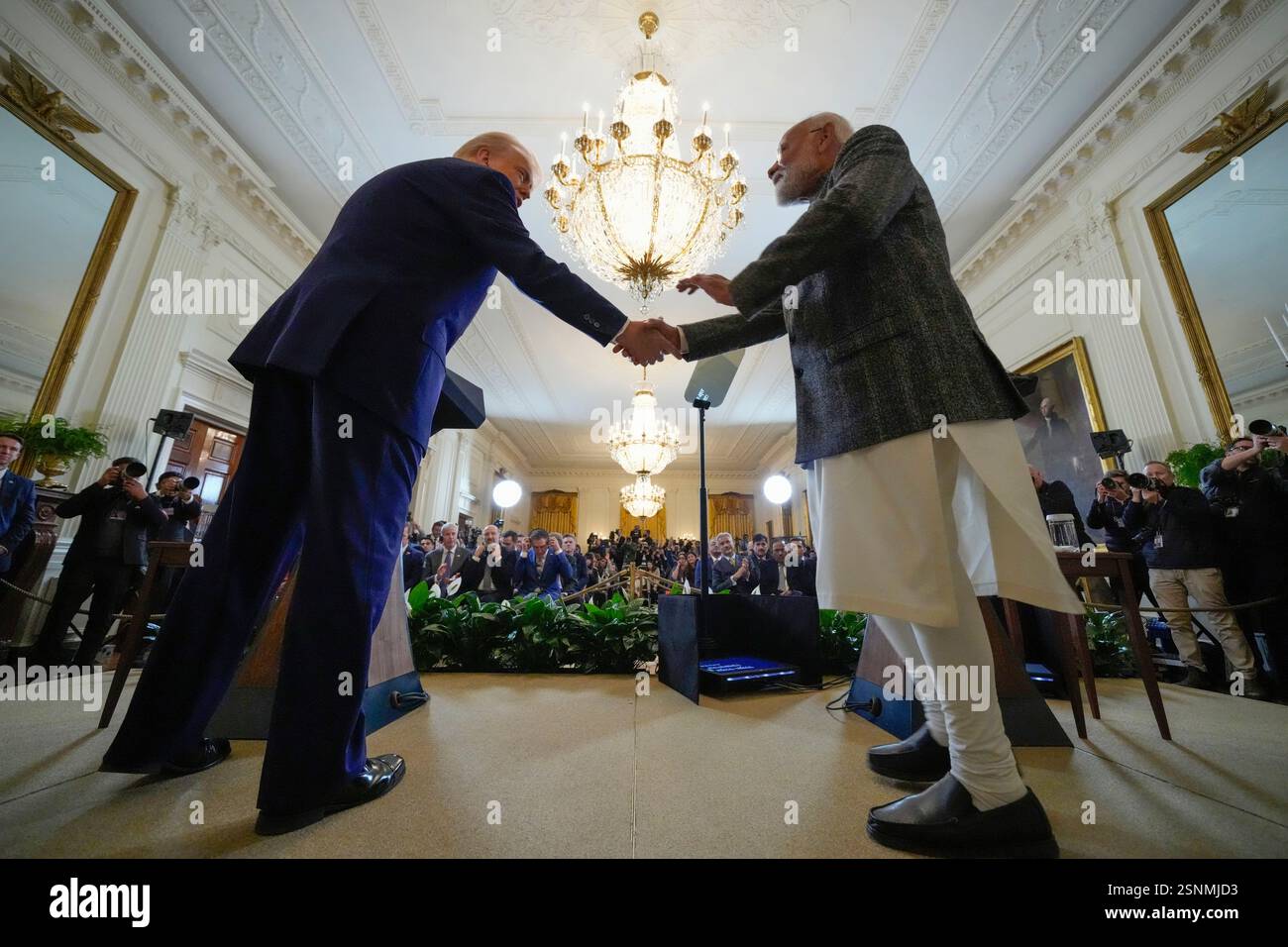 President Donald Trump and India's Prime Minister Narendra Modi shake ...