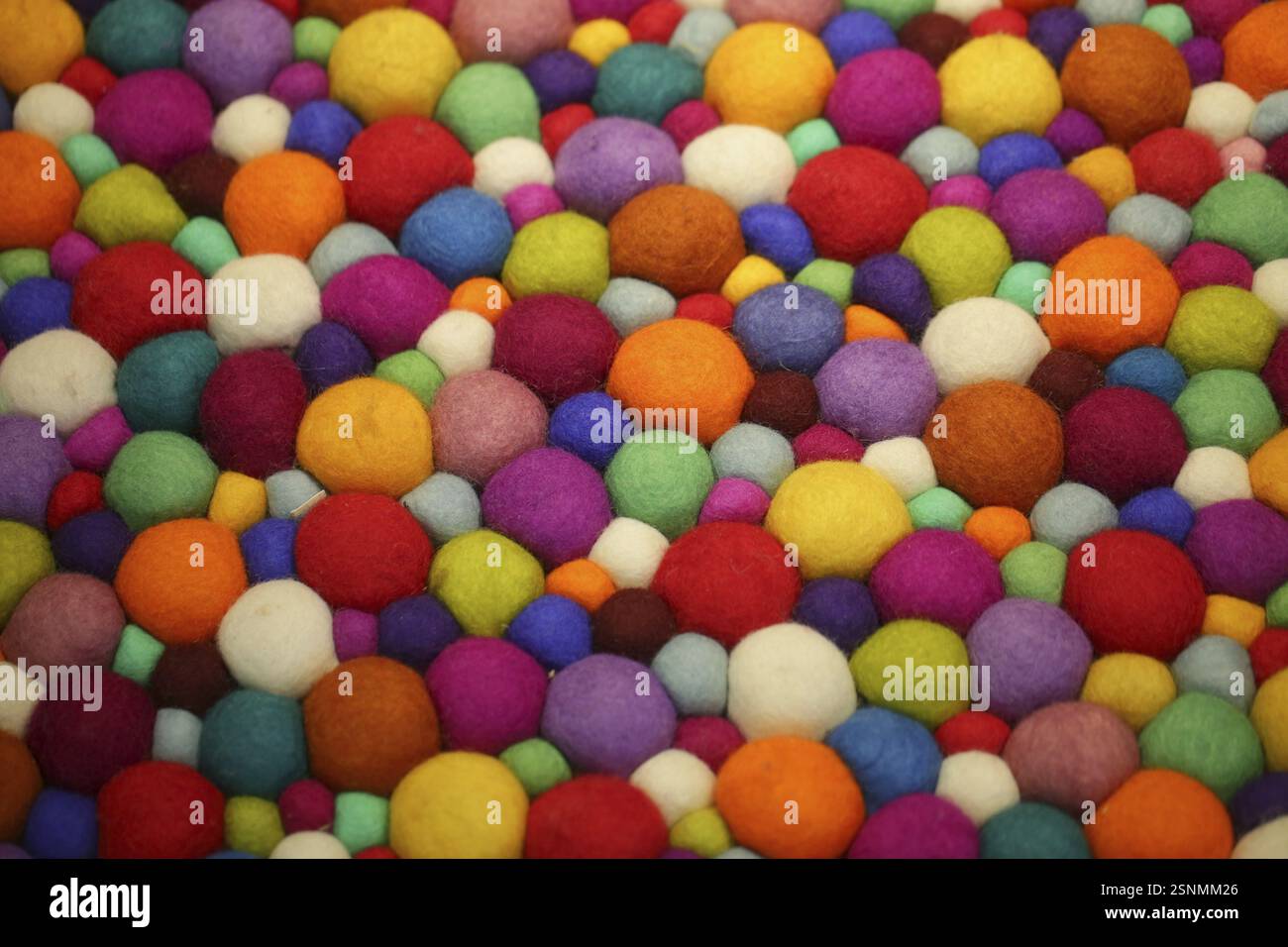 Felt balls of different sizes Felt mat colourfully felted at ...
