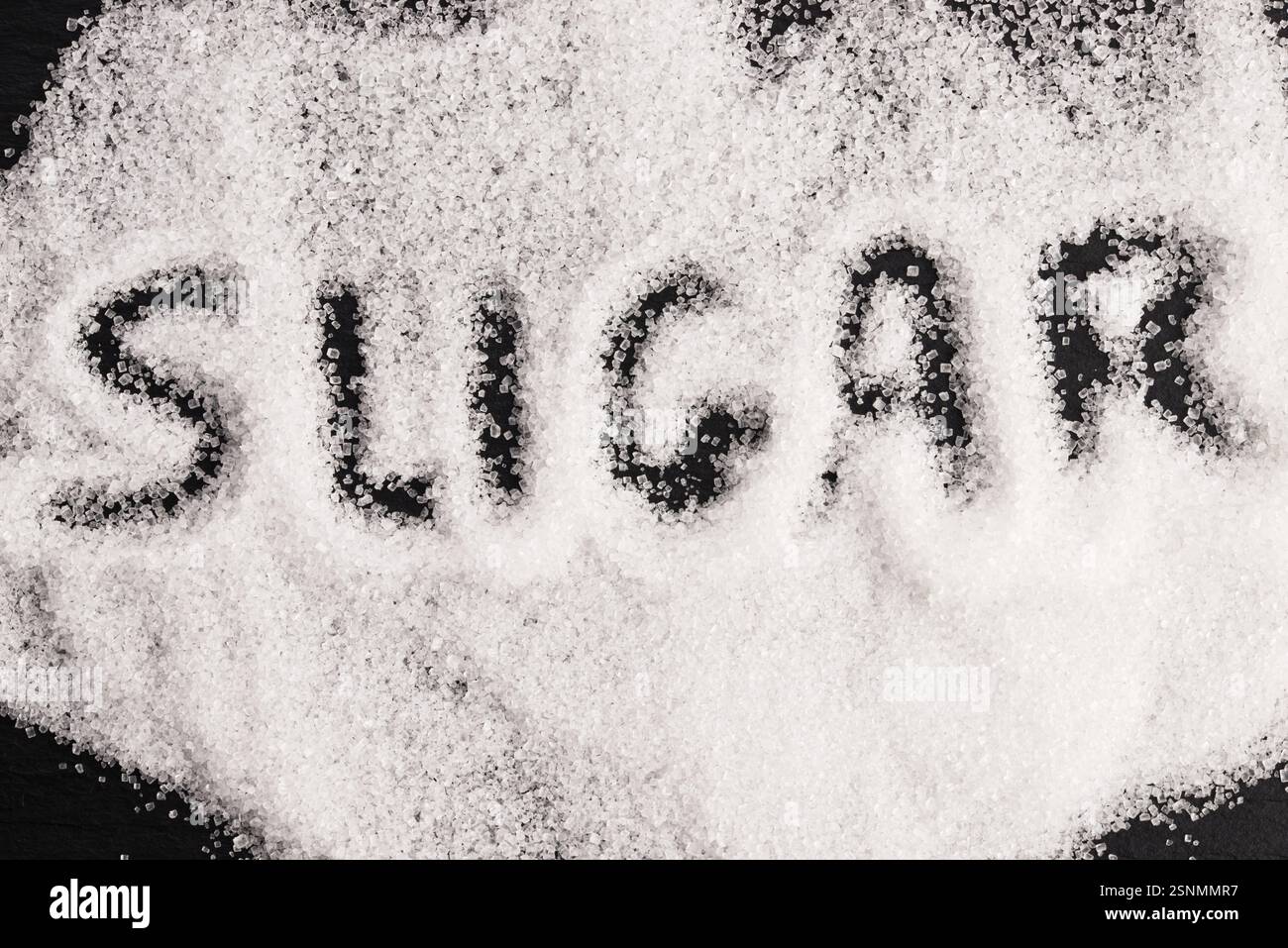The word sugar written into a pile of white granulated sugar Stock ...